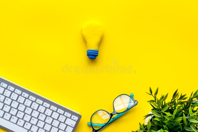 Insight, Inspiration Concept. Light Bulb on Yellow Office Desk Top-down ...