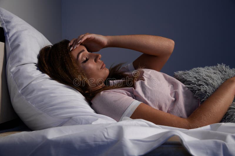 Insomnia Concept. Sleepless Sad Young Woman in the Bed. Stock Image ...