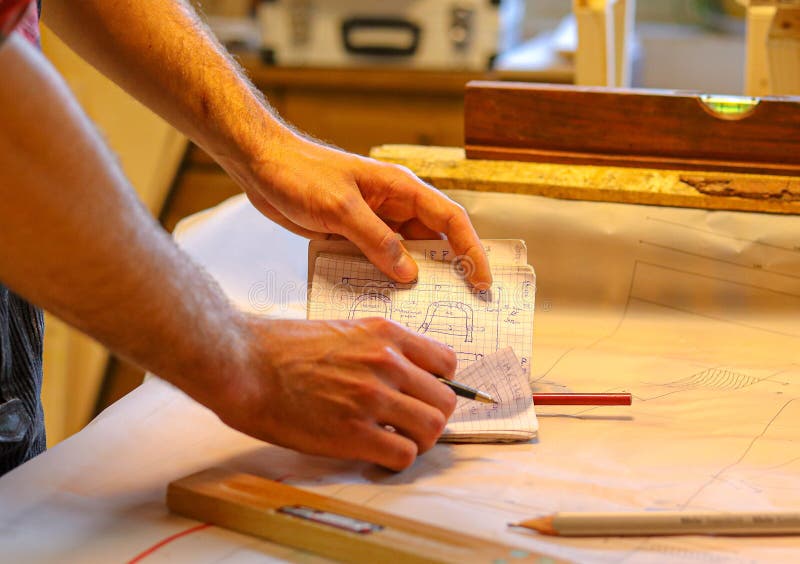 Inspect Notes while Working As a Carpenter Stock Image - Image of ...