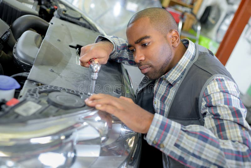 Inspecting the car boot stock image. Image of laborer - 119525317