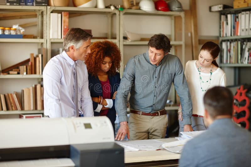 Inspecting Every Detail of Their Building Plan. a Group of Architects ...