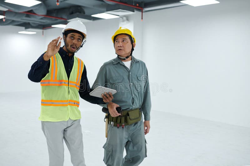 Inspecting Finished Building Stock Photo - Image of explain, hardhat ...