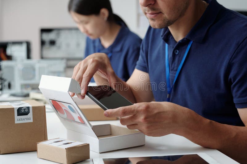 Inspecting New Smartphone in Technology Workshop Setting Stock Photo ...