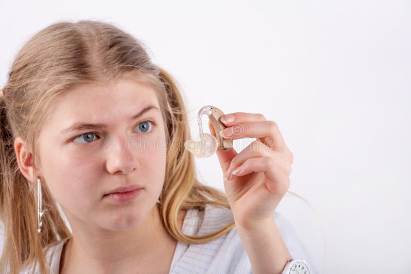 Inspection of a Hearing Aid Stock Photo - Image of deaf, device: 54862360