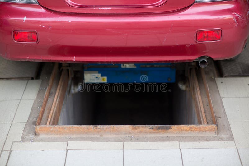 Inspection Pit in the Garage and Red Car Stock Image - Image of garage ...