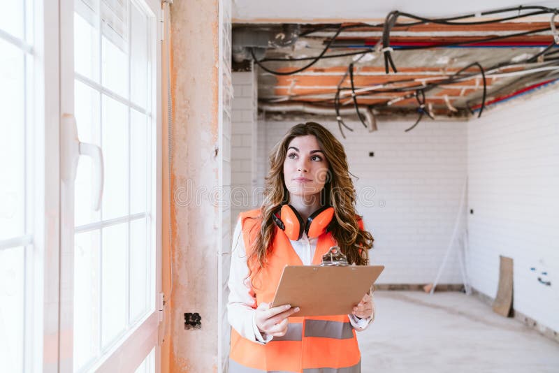 Inspector or Architect Professional Woman Checking Kitchen at ...