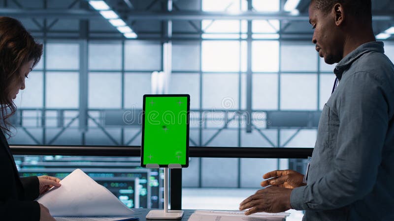 Inspector Checking Documents in Server Hub and Using Greens Screen ...