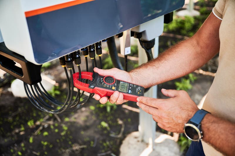 Inspector Checking Output Voltage Level of Inverter. Stock Image ...