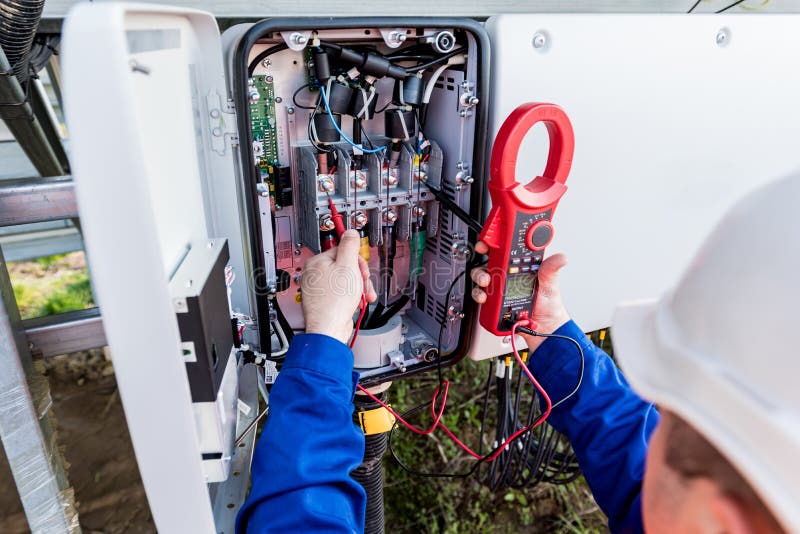 The Inspector Checks the Actual Output Voltage Level of Inverter Stock ...