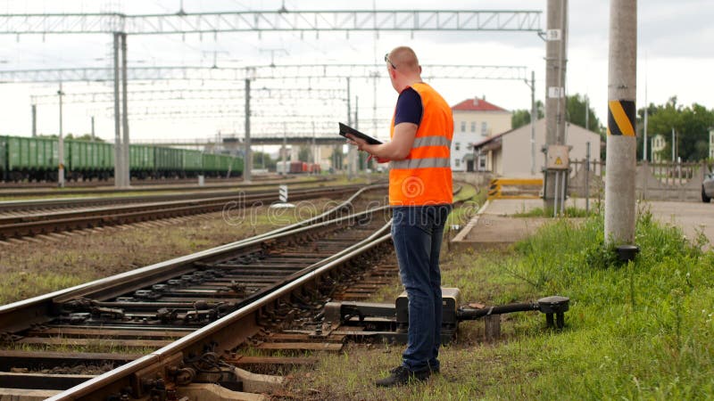Inspector Inspects Checks the Automatic Switch Mechanism on the Railway ...