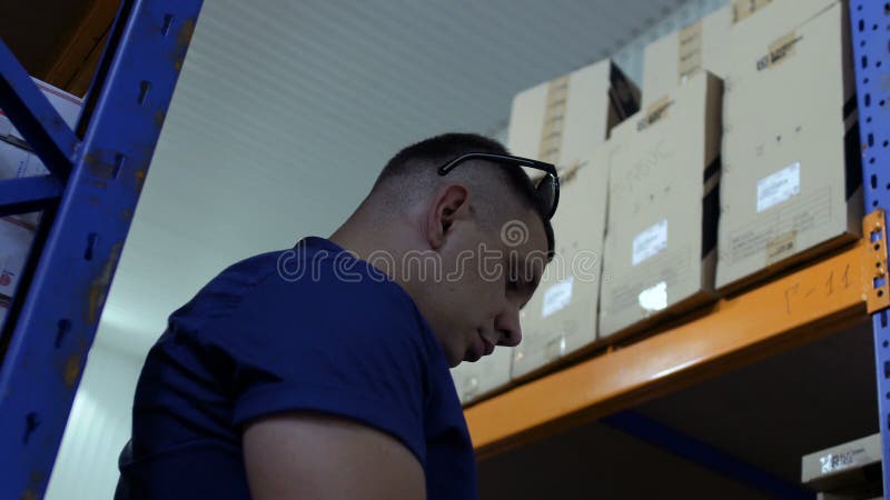 Inspector Make Inventory on Storage and Check the Boxes Stock Video ...