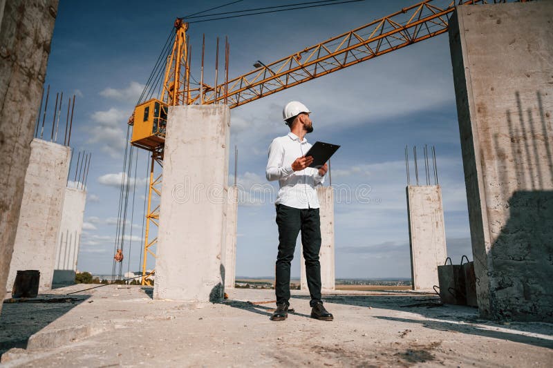 Inspector with Notepad is Standing on the Construction Site Stock Photo ...