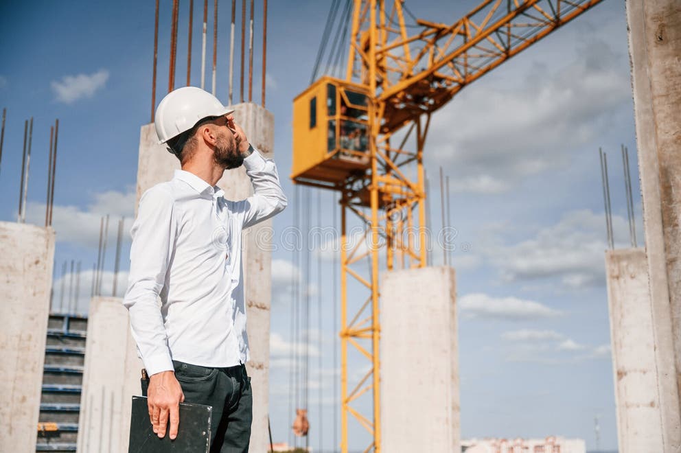 Inspector with Notepad is Standing on the Construction Site Stock Image ...