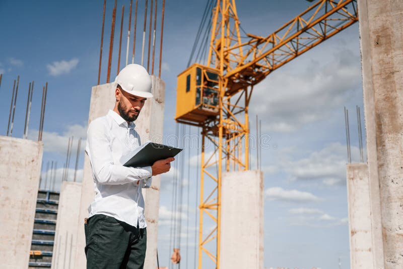 Inspector with Notepad is Standing on the Construction Site Stock Image ...