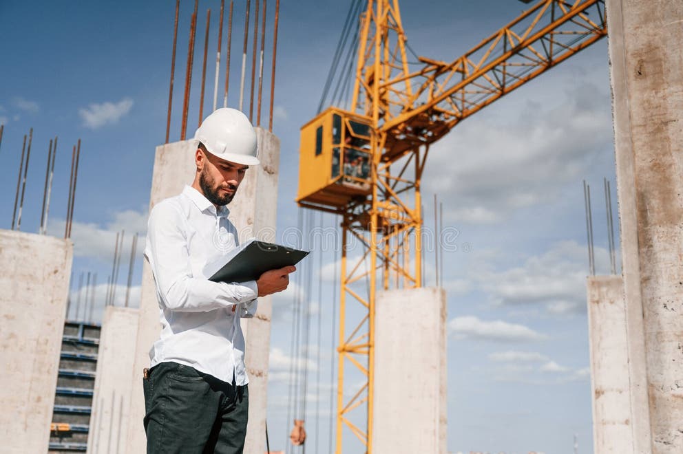 Inspector with Notepad is Standing on the Construction Site Stock Image ...