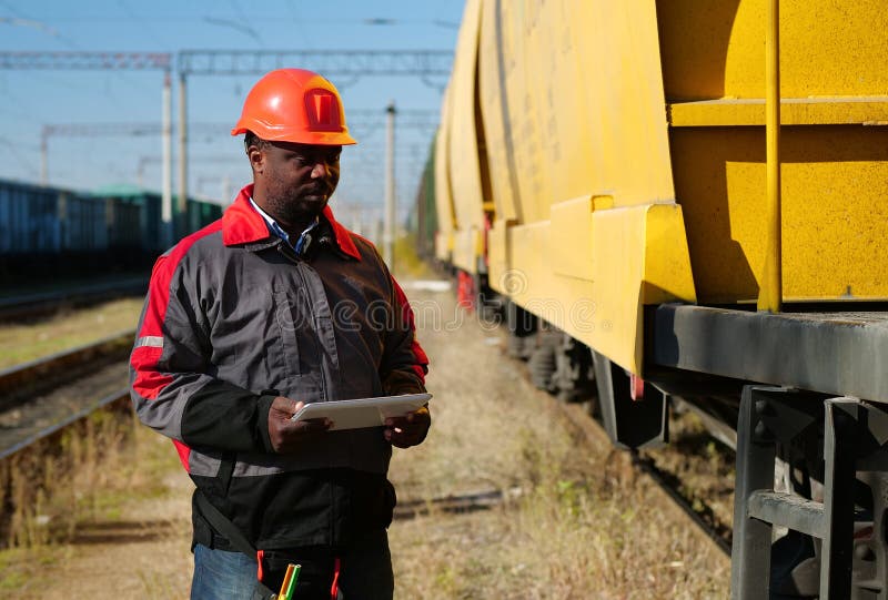 African American Railway Man with Tablet Computer at Freight Train ...