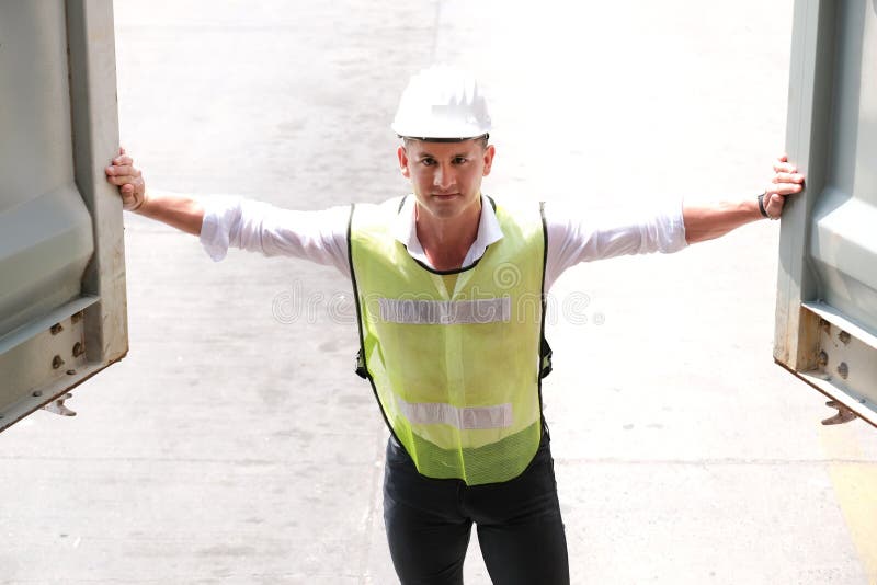 Inspector Worker Who Wears a Safety Helmet and Vest Opens the Container ...