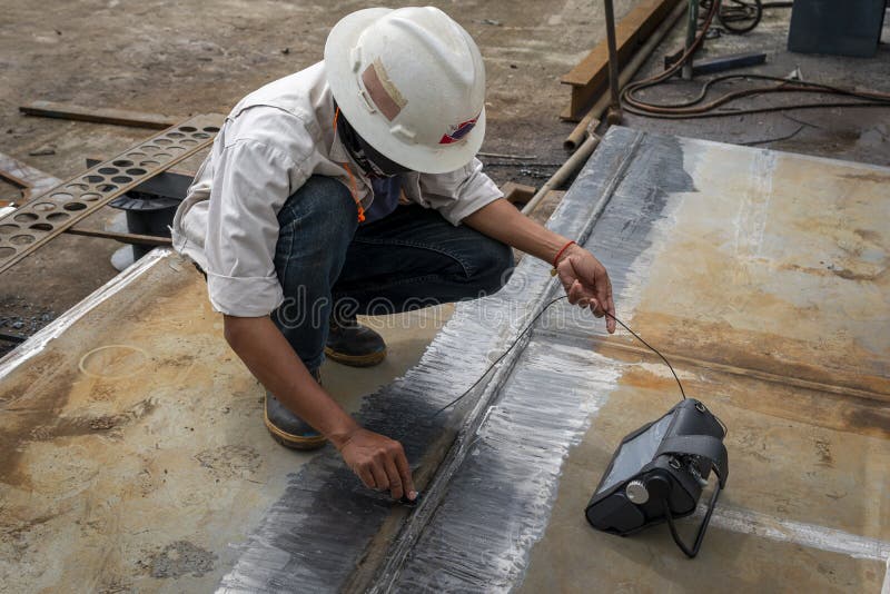 The Inspectors are Checking Defect in Welded of Steel Plate Add Joint ...