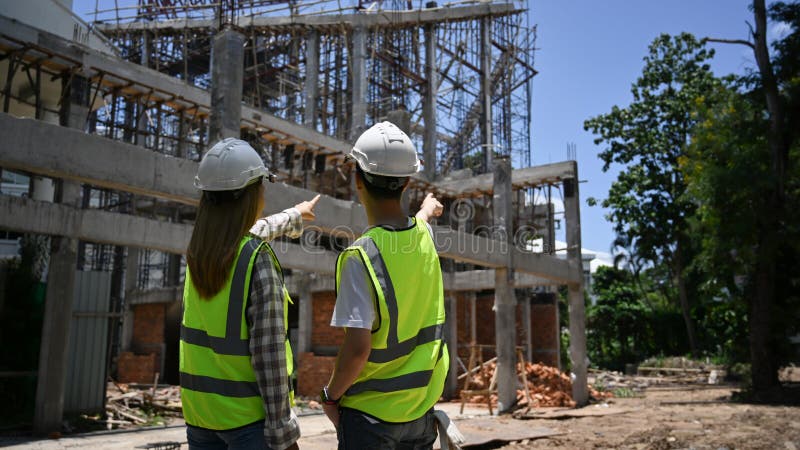 Inspectors and Head Engineer Working Together at Construction Site ...