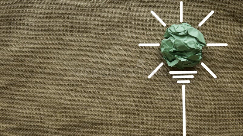 Inspiration Concept. a Green Crumpled Paper Ball with a Light Bulb Icon ... Inspiration Concept. a Green Crumpled Paper Ball with a Light Bulb Icon ...