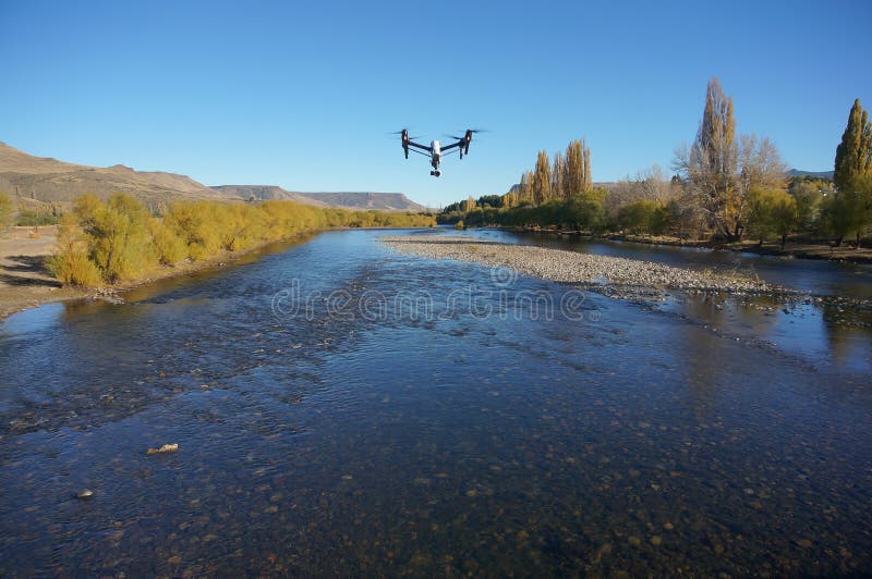 Inspire Quadcopter Drone Flying Over River. Front View Stock Photo ...