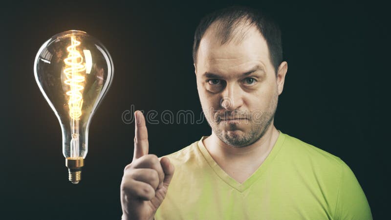 Inspired Man and Big Shining Light Bulb. Insight or Idea Concepts Stock ...