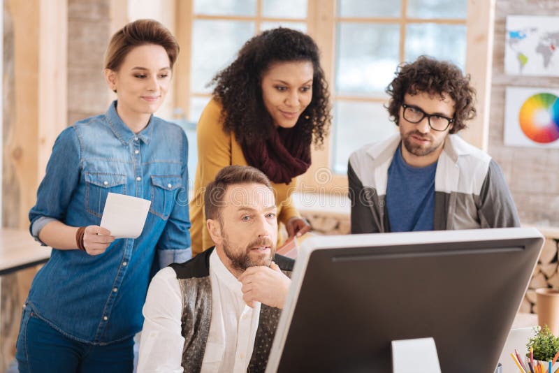 Inspired Employees Smiling and Hugging Stock Photo - Image of ...