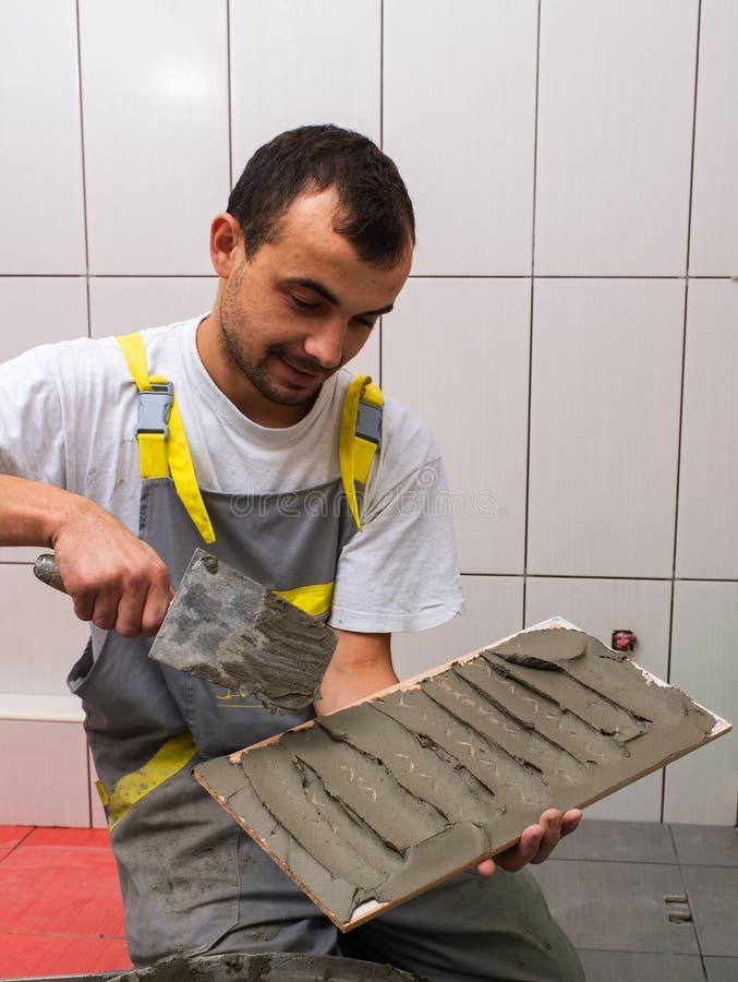 Install ceramic tiles stock photo. Image of industry - 263843586