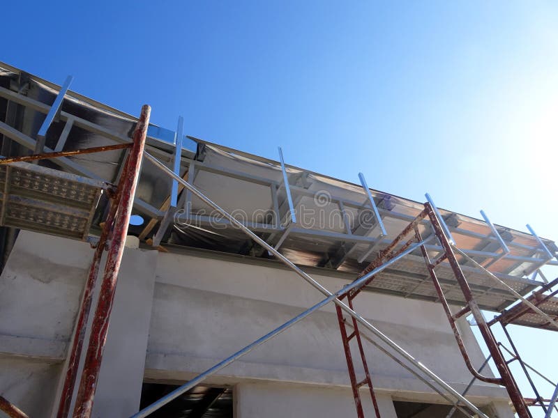 Installation of the Aluminum Cladding Frame at the End of the Roof is ...