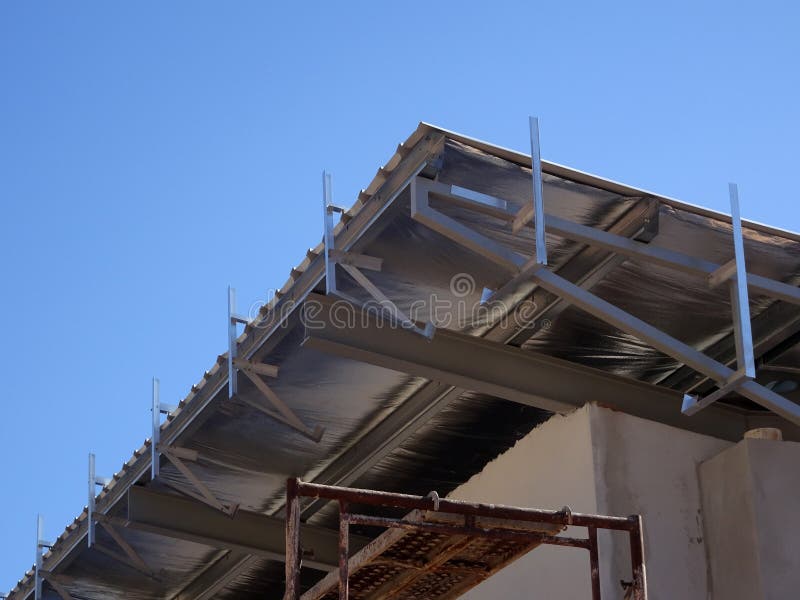 Installation of the Aluminum Cladding Frame at the End of the Roof is ...