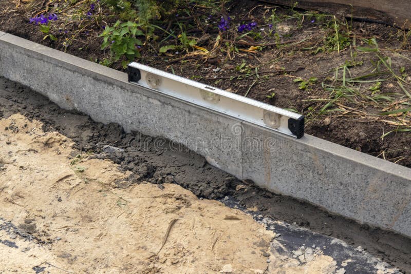 Installation of Boundary Limiters. Installation of Curbs in Semi-dry ...