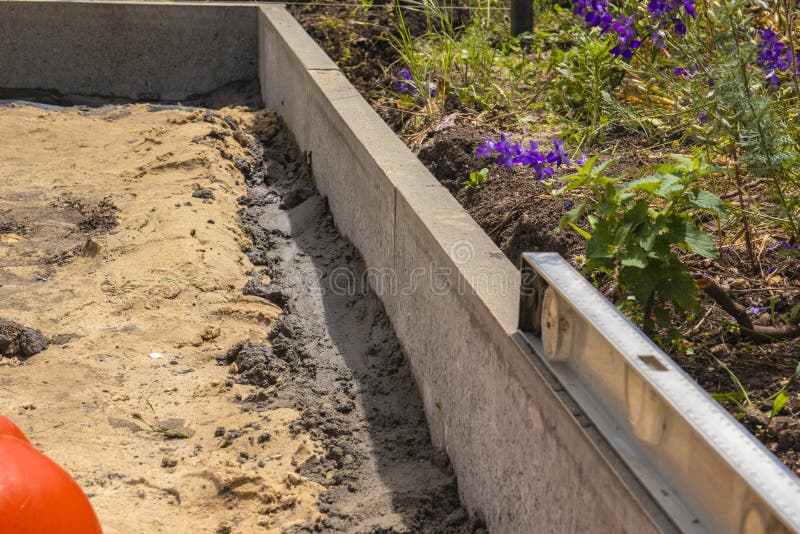 Installation of Boundary Limiters. Installation of Curbs in Semi-dry ...