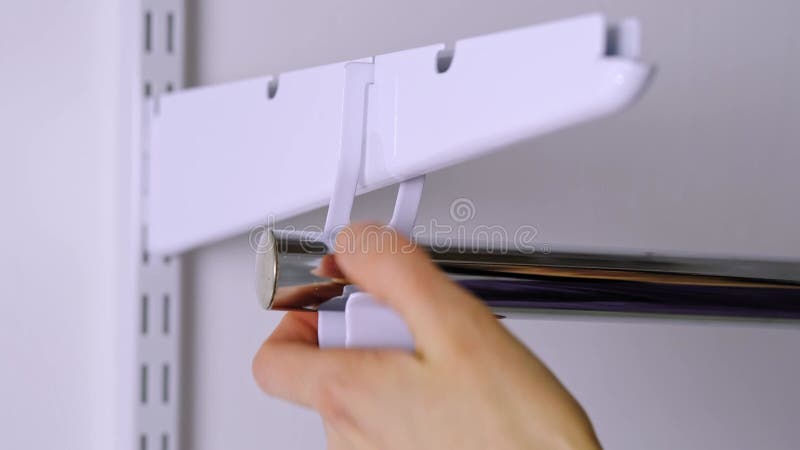Installation Brackets of a Metal Mesh Shelf in the Dressing Room System ...