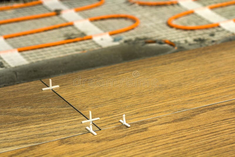 Installation of Ceramic Tiles and Heating Elements in Warm Tile Stock ...