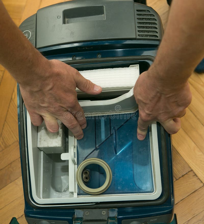 The Process of Cleaning a Room with a Vacuum Cleaner with an Aquafilter ...