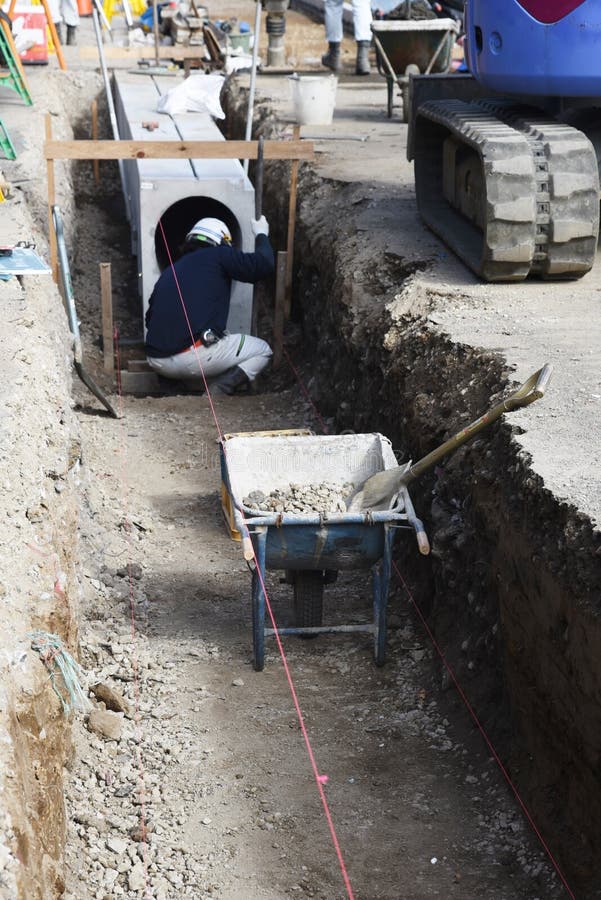 Installation Construction Of Street Gutter On The Road Stock Image ...