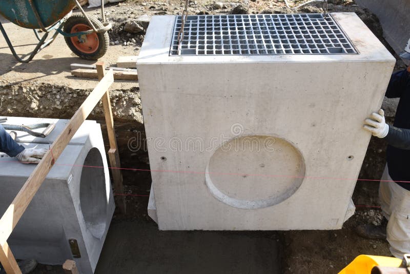 Installation Construction of Street Gutter on the Road Stock Photo ...