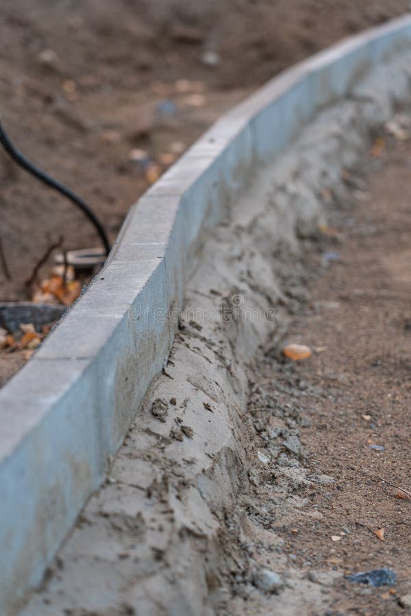 Installation of Curbs at the Construction Site. Curved Line Road Curb ...