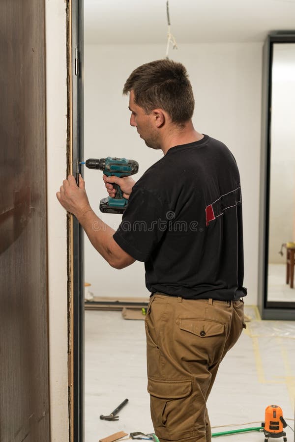 Installation of Door Hinges, Installation of Interior Doors Stock Photo ...