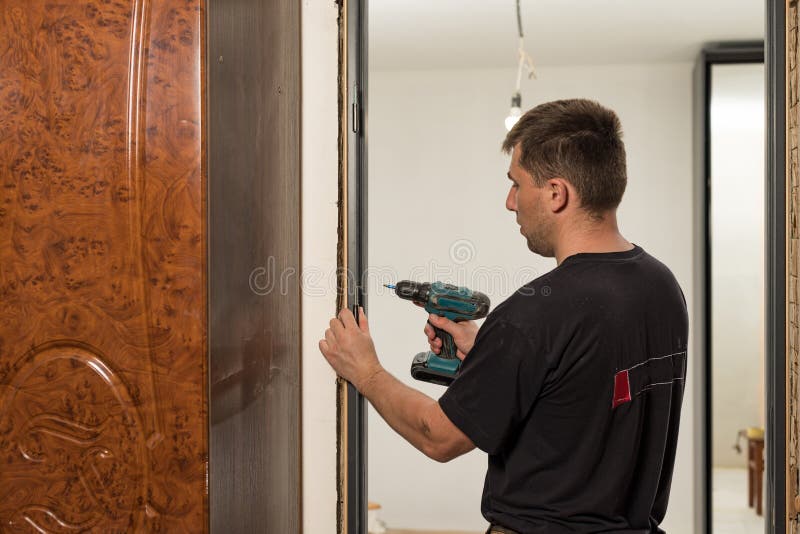 Installation of Door Hinges, Installation of Interior Doors Stock Photo ...