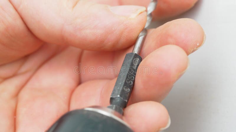 Installation of the Drill in the Screwdriver. Professional Tools Stock ...