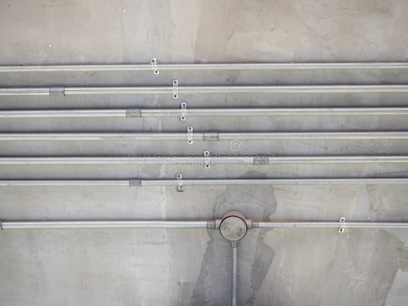 The Installation of a Electric Wire System on Cement Wall Stock Image ...