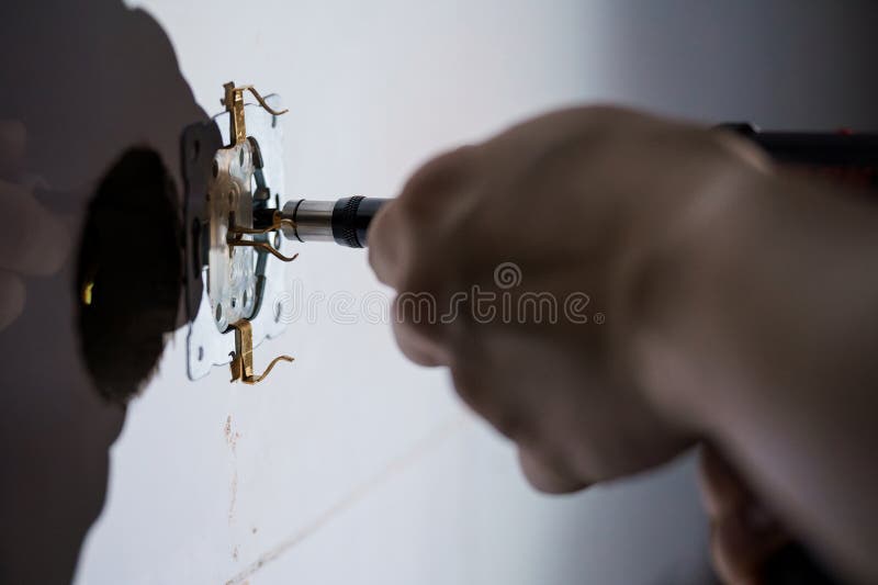 Installation of Electrical Outlet with Hand Using Screwdriver Tool ...