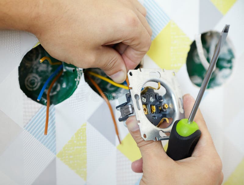 Installation of an Electrical Outlet, Work with an Electric Cable Stock ...