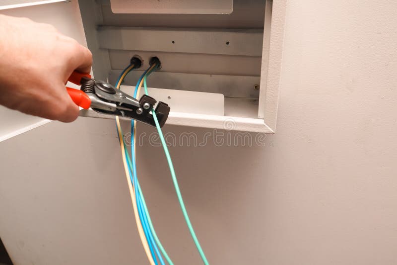 Installation of Electrical Panel. Electrician Working on Electric Panel ...