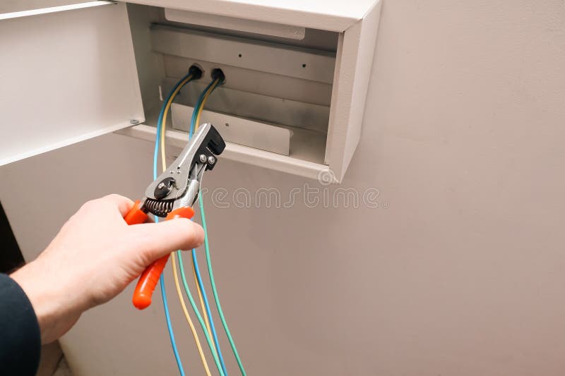 Installation of Electrical Panel. Electrician Working on Electric Panel ...