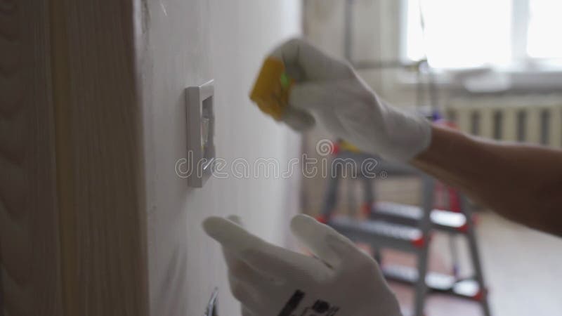 Installation of an Electrical Switch on the Wall during the Renovation ...