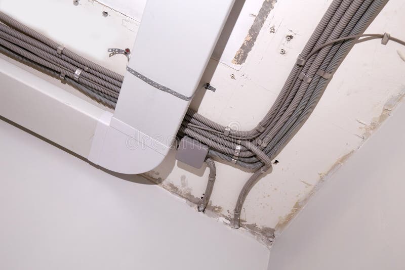 Installation of Electrical Wiring and Ventilation on the Ceiling. Stock ...