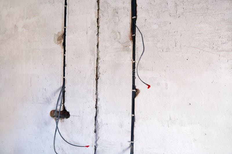 Installation of Electrical Wiring in the Walls of the Premises Being ...