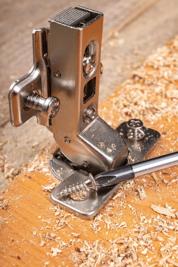 Installation of Furniture Hinges in a Chipboard. Minor Carpentry Work ...